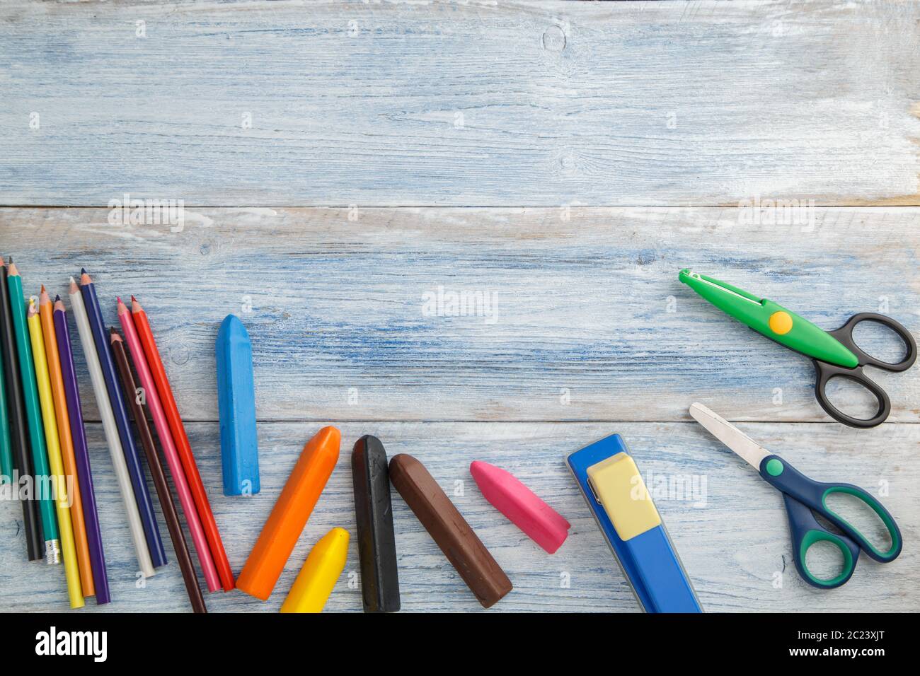 school children's concept. colored pencils,stapler and scissors on a ...