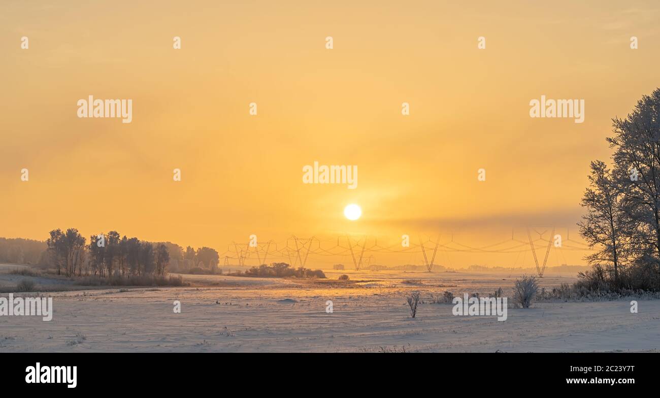 winter, frosty landscape of nature with dim evening sunlight, fog and ...