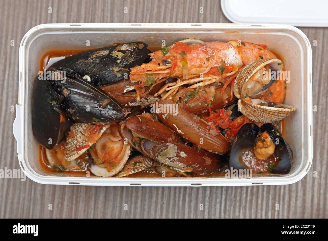 Shrimps and Clams Shells Sea Food in Plastic Box Stock Photo - Alamy