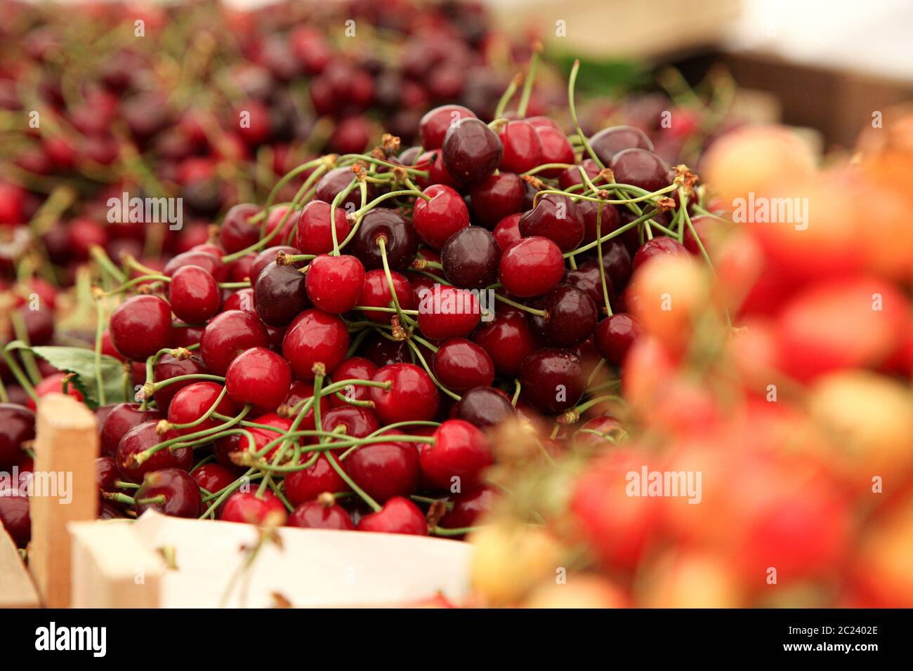 Fresh red cherries in the grocery for sale Stock Photo - Alamy