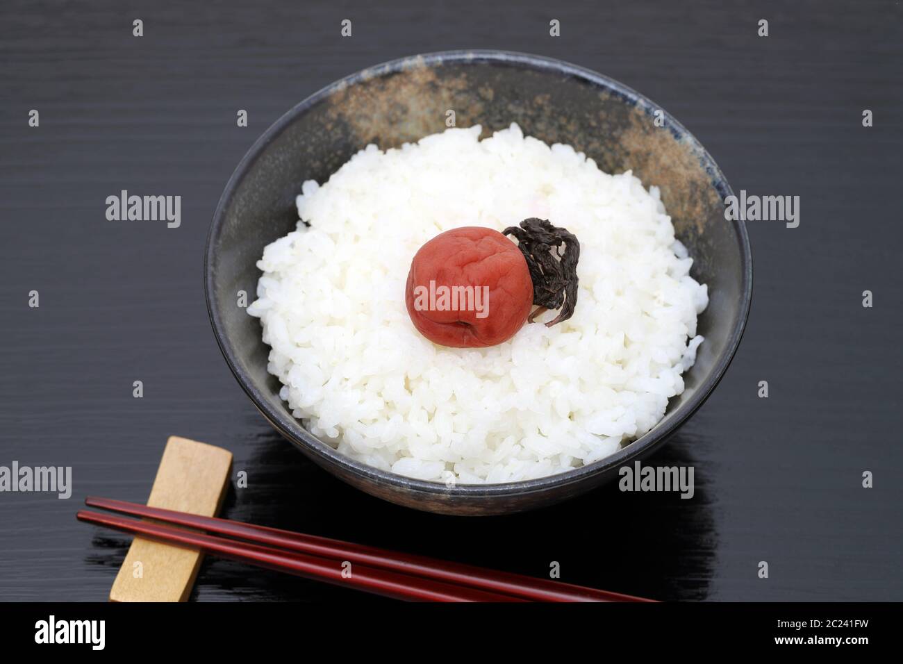 Japanese food, Umeboshi pickled salt plum on white rice Stock Photo - Alamy