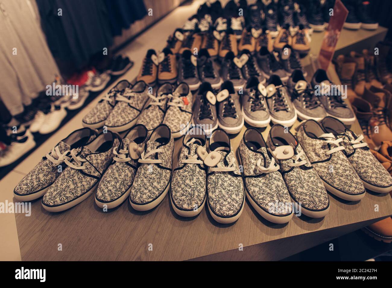 Men shoes in clothes store. Stylish young men's shoes in a clothing ...