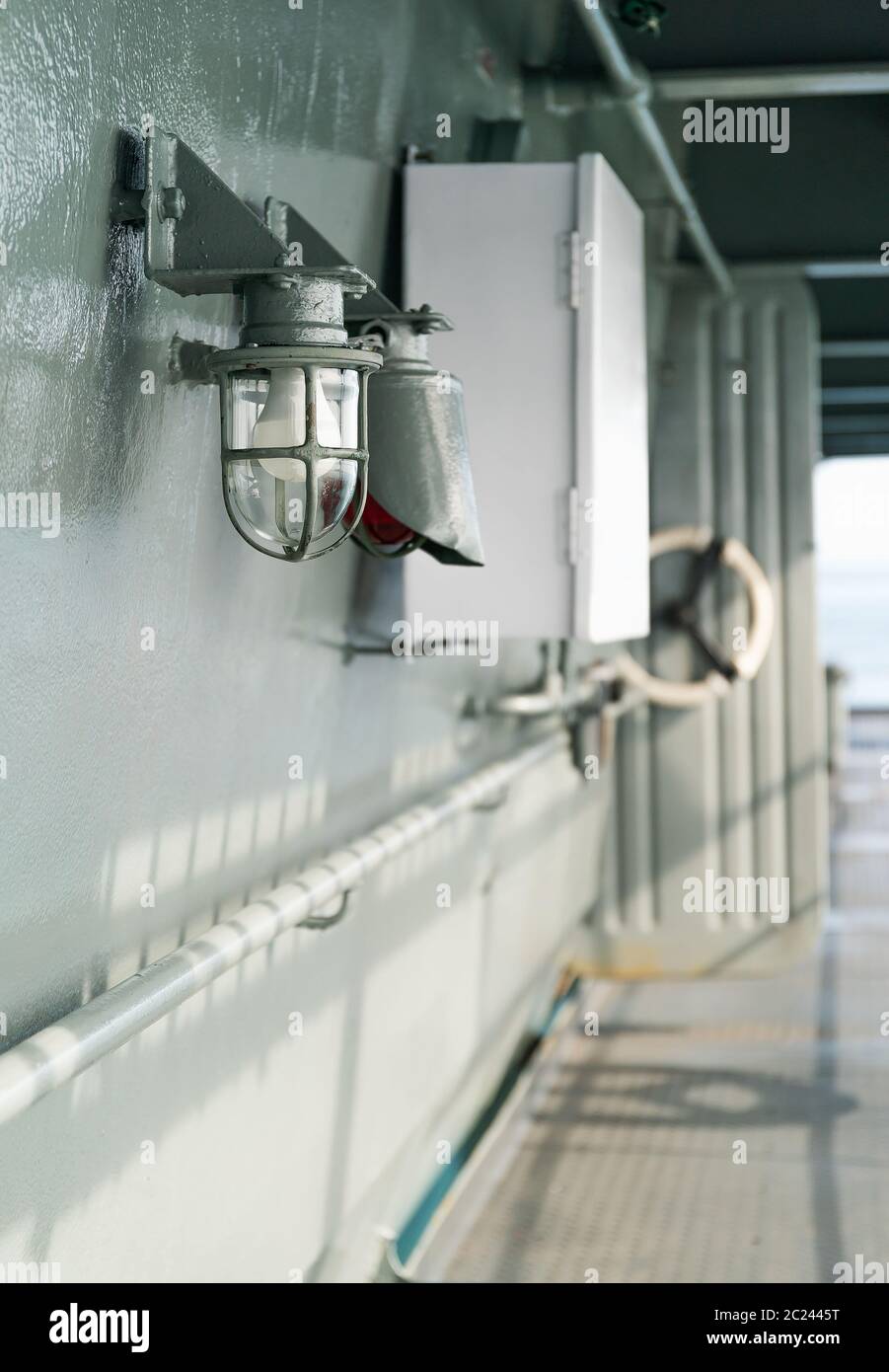 Deck lamp on ship with metal frame fixed in protective cage Stock Photo ...