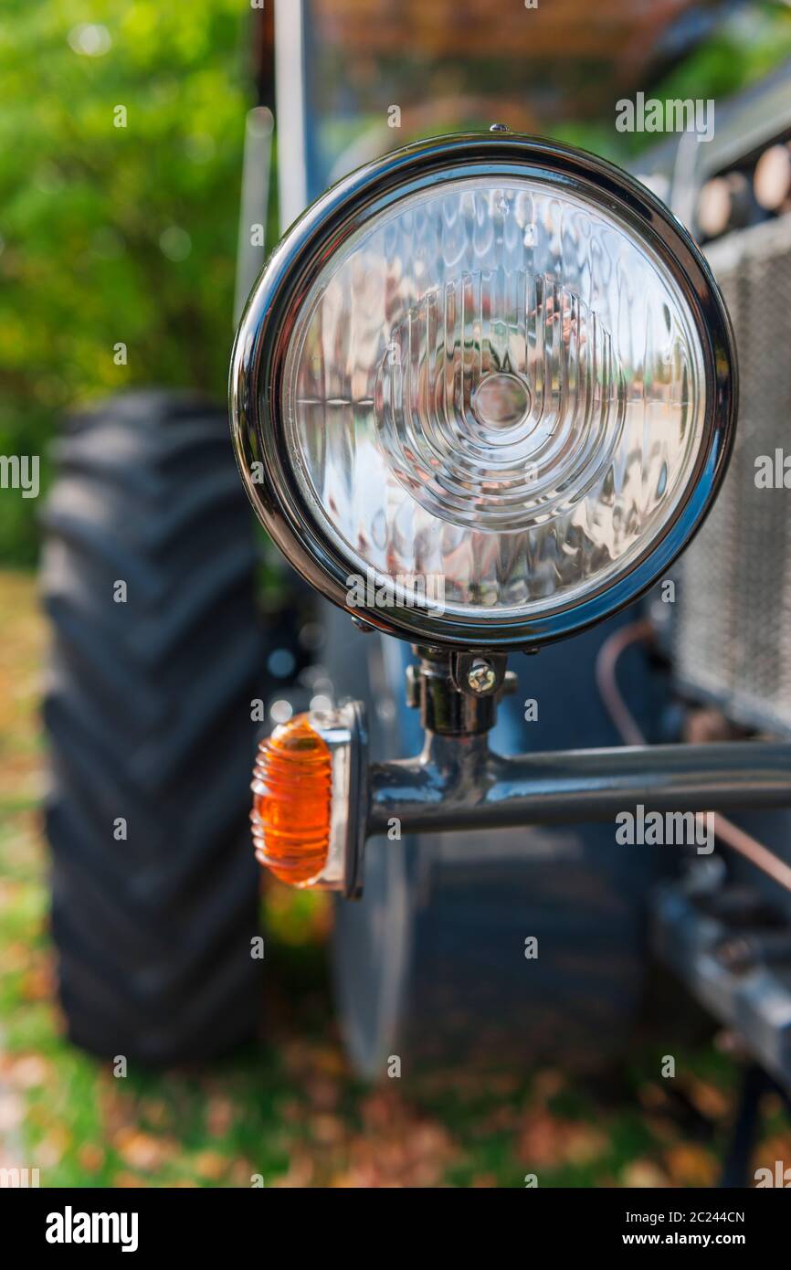 Wide-angle closeup of the right front headlight on an old restored ...