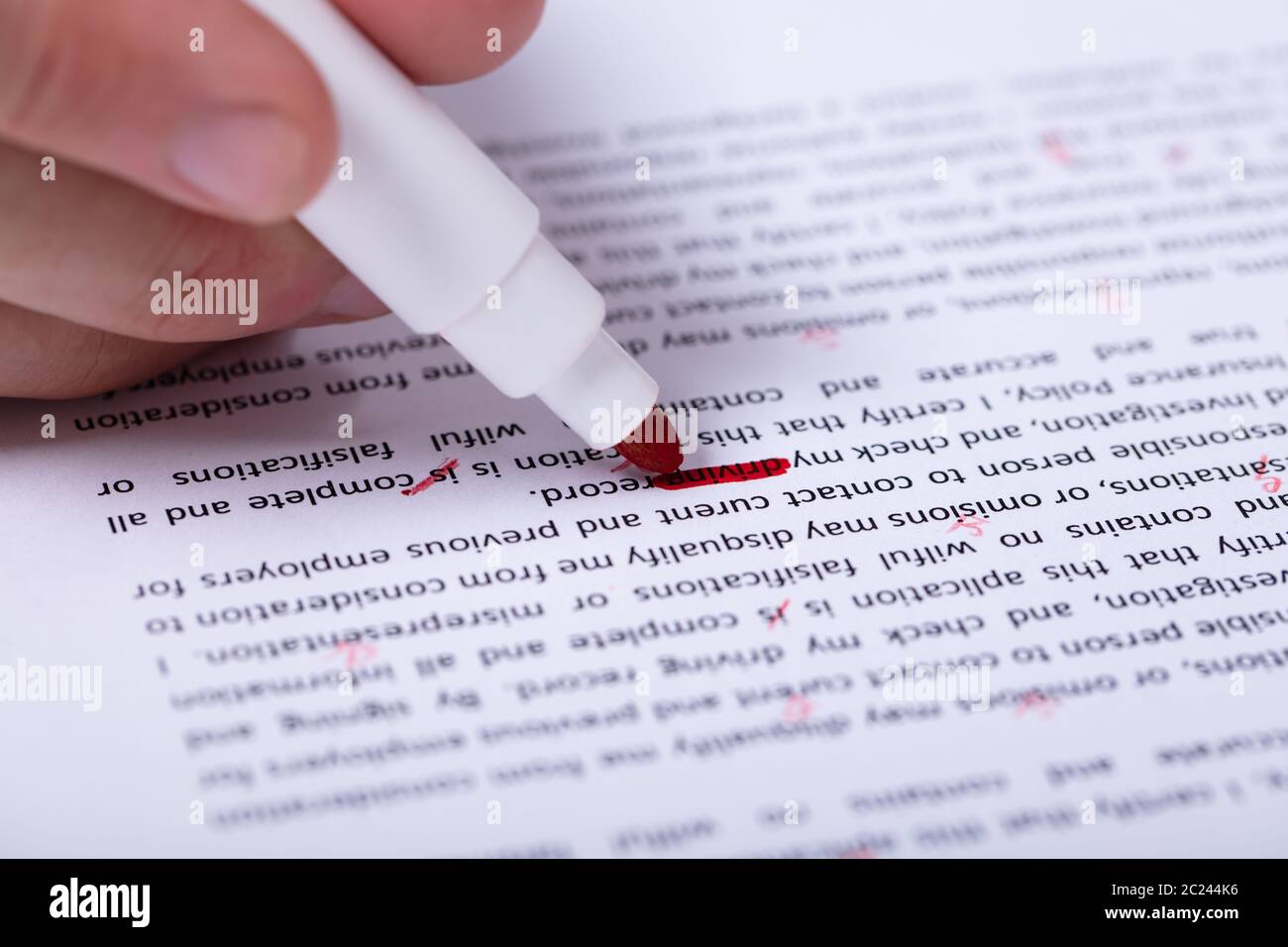 Close-up Of A Person's Hand Marking Error With Red Marker On Document ...
