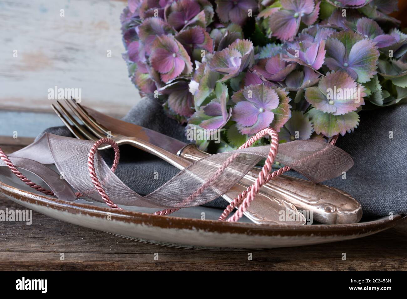 Table setting with hydrangeas in vintage style Stock Photo - Alamy