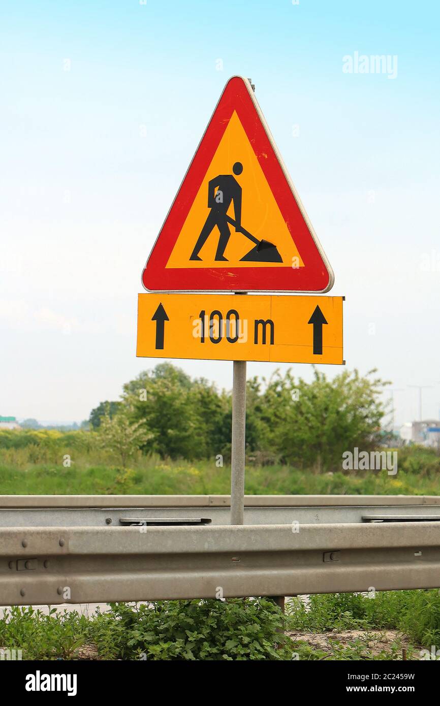 Road works triangle traffic sign outside on the street Stock Photo - Alamy