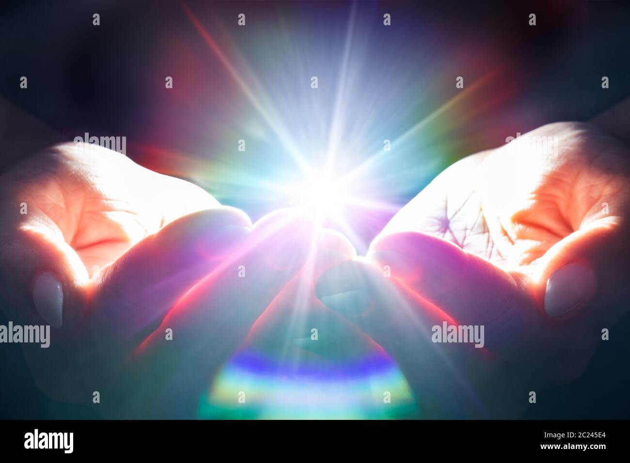 Close-up Of Mysterious Glowing Power In The Hands Stock Photo - Alamy