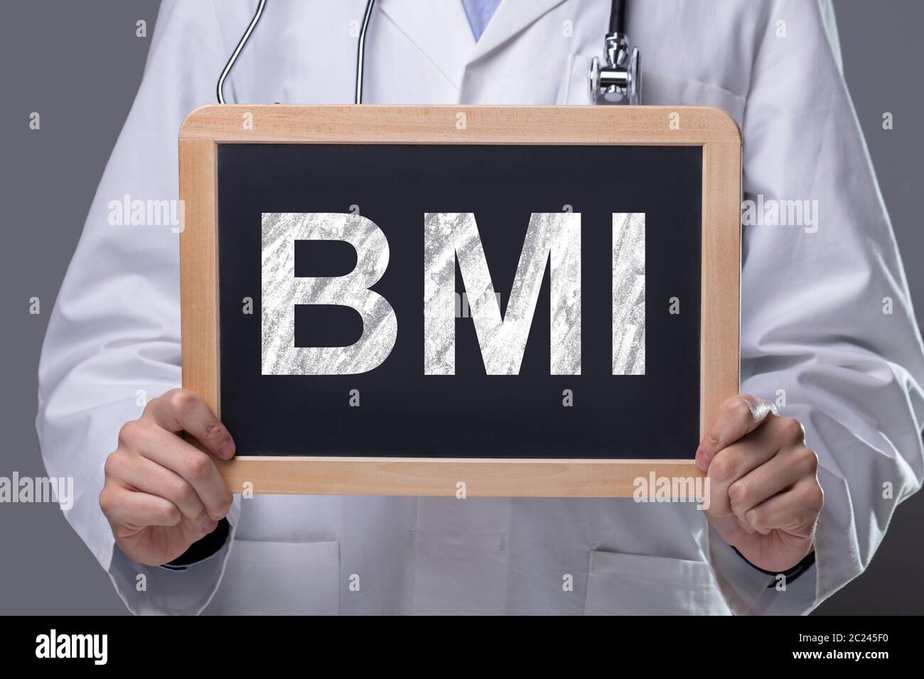 Mid-section Of Male Doctor Showing Wooden Slate With Bmi Text Against ...