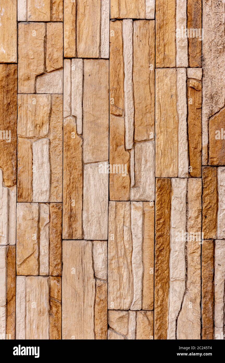 Rock stone brick tile wall has a detailed background texture sepia ...