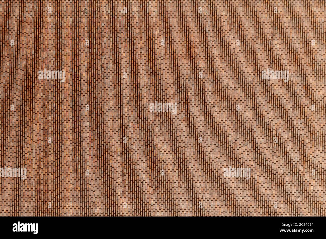 Background texture with texture of small red bricks of various shades ...