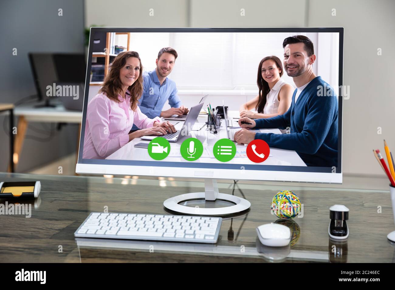 Computer Desktop Showing Videoconferencing Application On Office Desk ...
