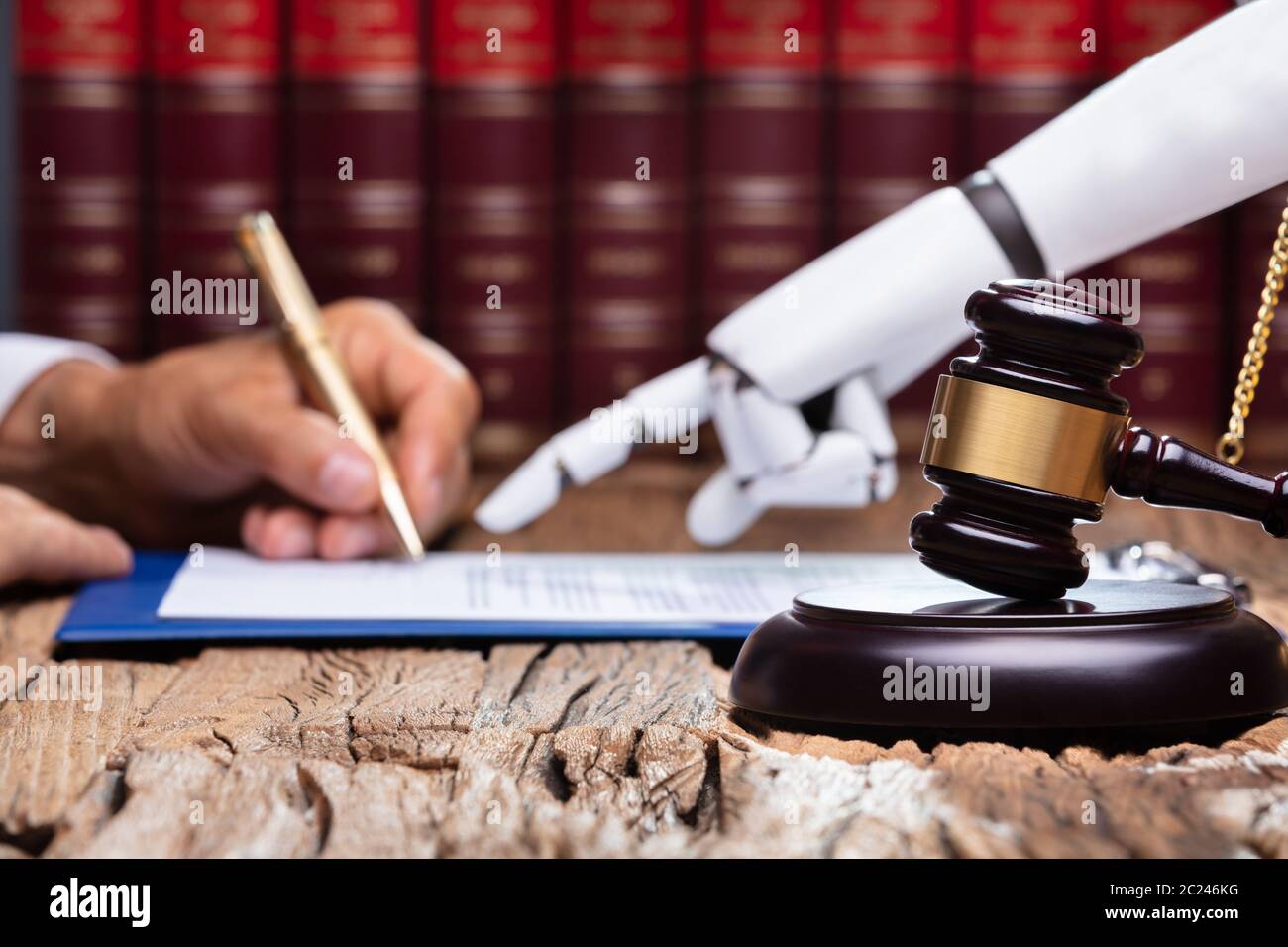 Robotic Hand Assisting Person For Signing Document Over Reflective Desk ...