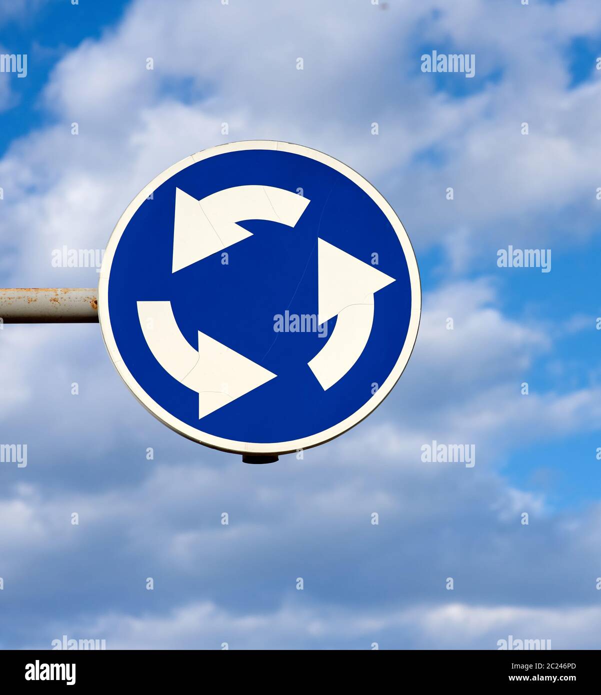 round metal blue road sign circle motion on sky background Stock Photo ...
