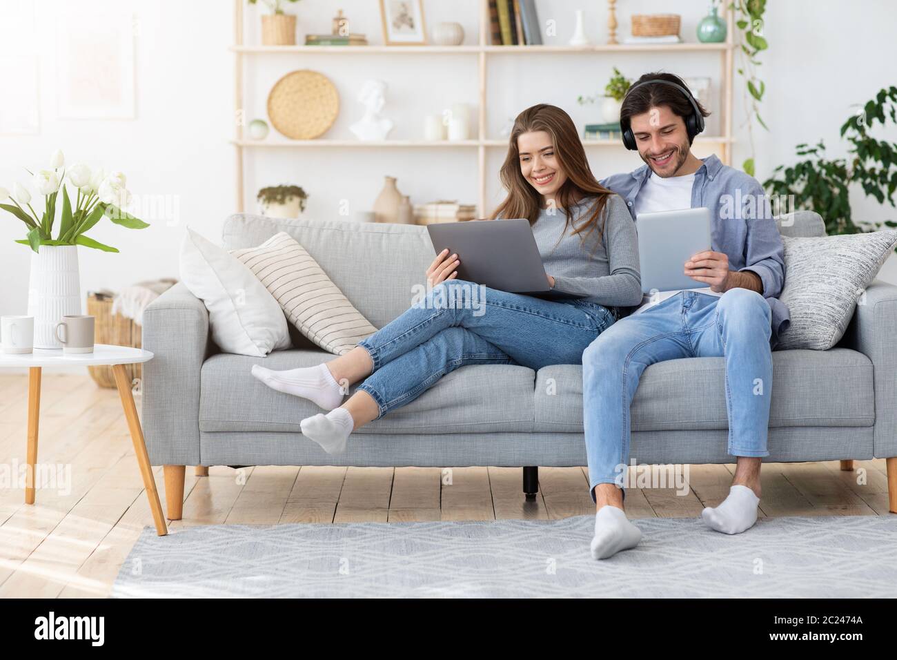 Family using electronic gadgets hi-res stock photography and images - Alamy
