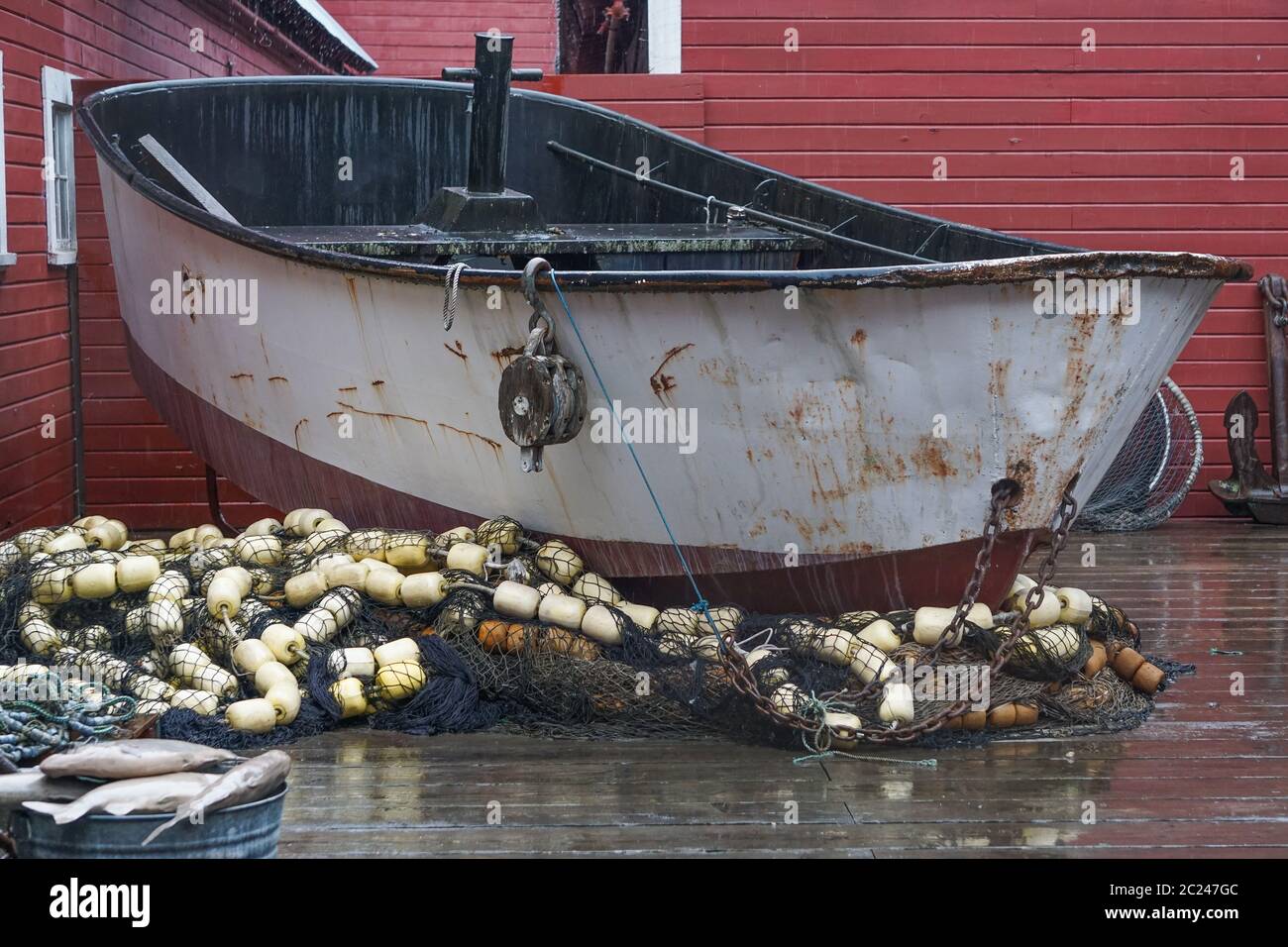 Hoonah, Alaska: A rusty fishing boat and various fishing nets on ...