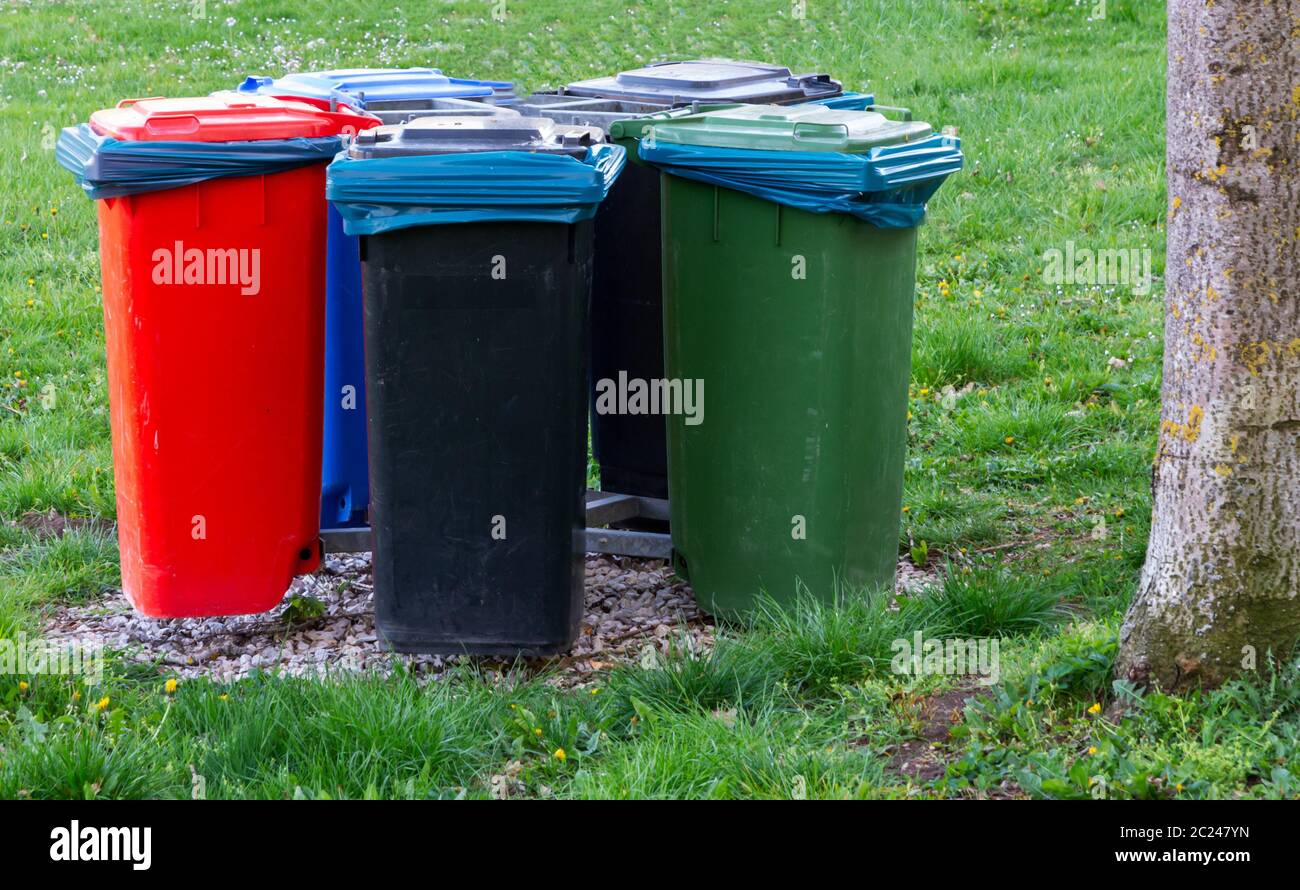 Garbage cans for waste separation and recycling in a park Stock Photo ...