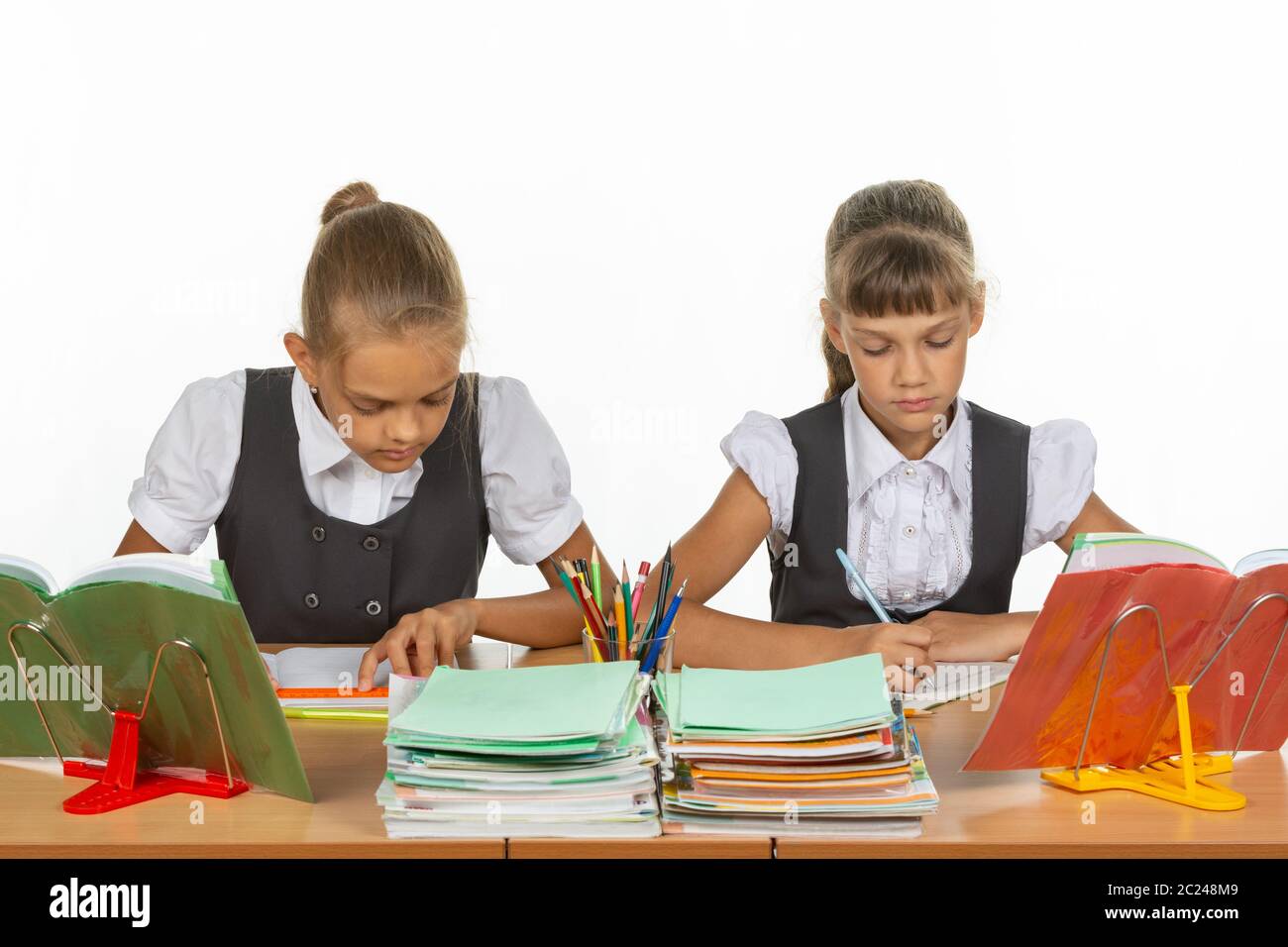 Two girls in a lesson at school Stock Photo - Alamy