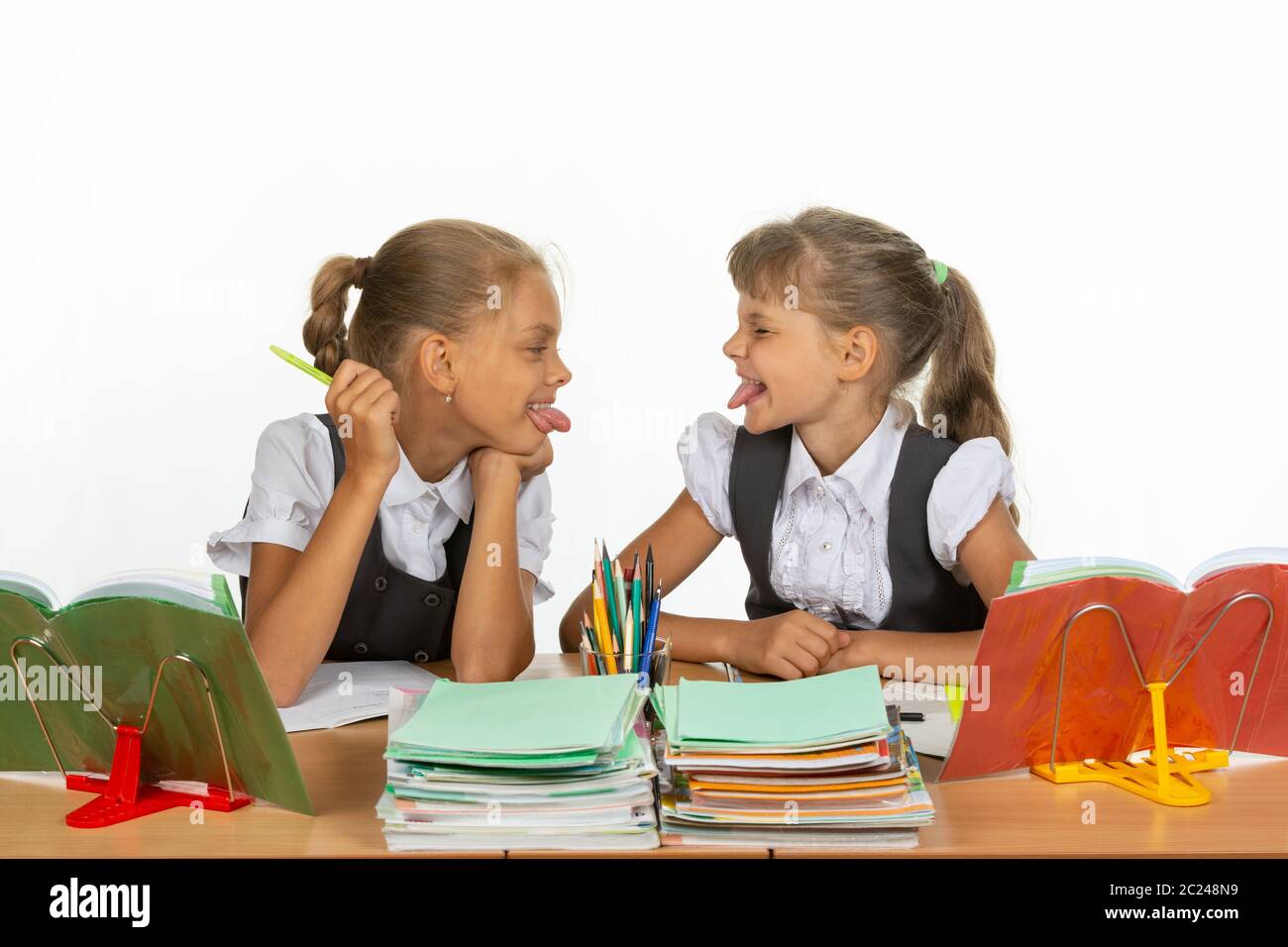 Classmates show each other language Stock Photo - Alamy