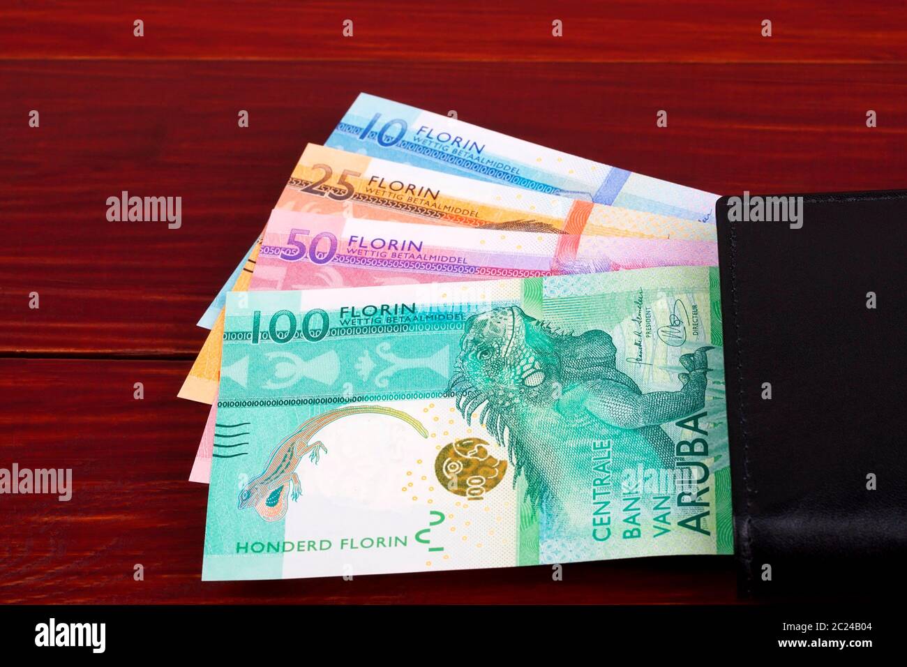 Aruban Florin in the black wallet Stock Photo - Alamy