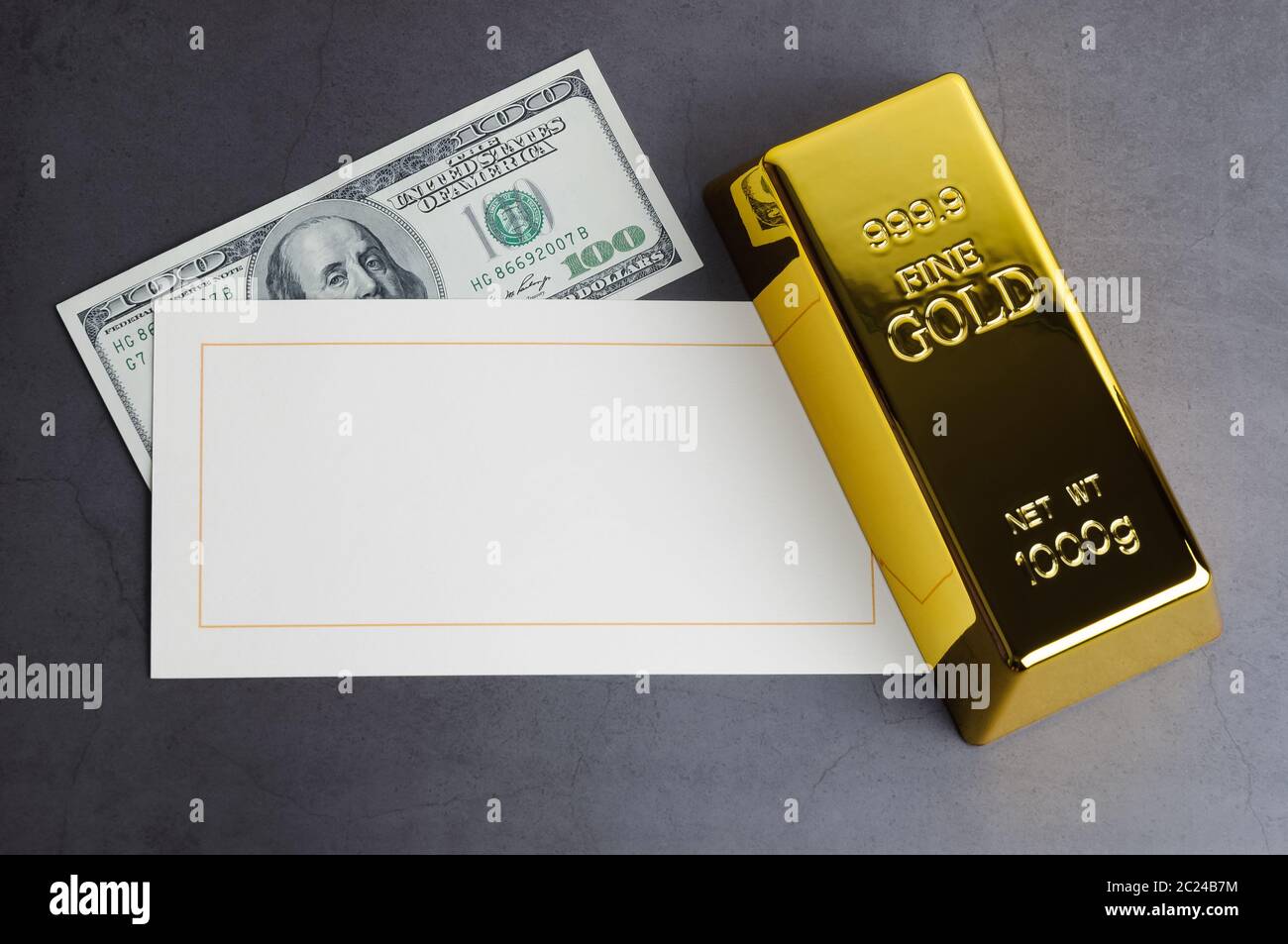Gold bar ingot bullion dollar bill and greeting card Stock Photo - Alamy