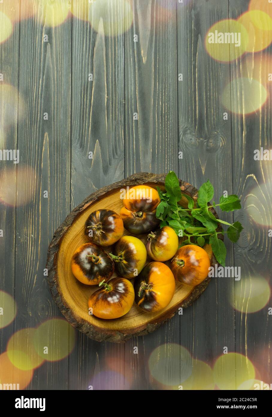 Yellow tomatoes Siberian tiger on wooden background. Homegrown yellow ...