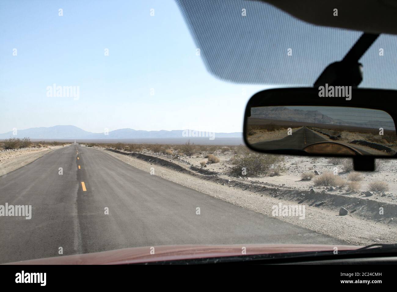 String straight road through desert Stock Photo - Alamy