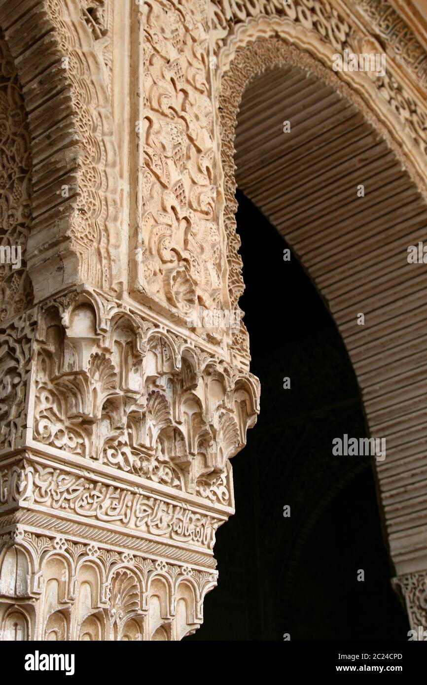 Moorish arch carved in stone on passage with ornament Stock Photo - Alamy