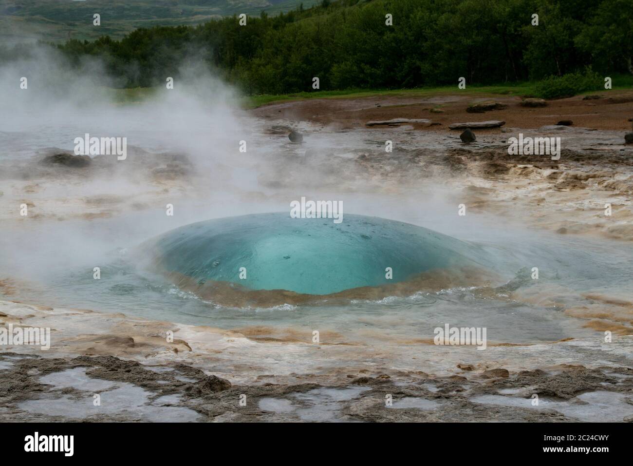 Water bubble of geyser shortly before explosion Stock Photo - Alamy