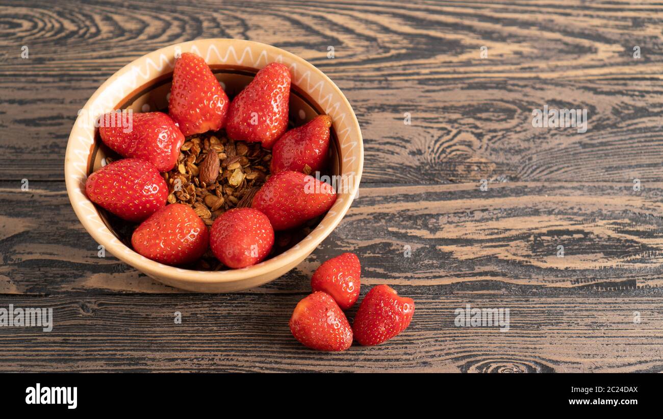 Rustic delicious and easy coked breakfast at home. Granola strawberry ...