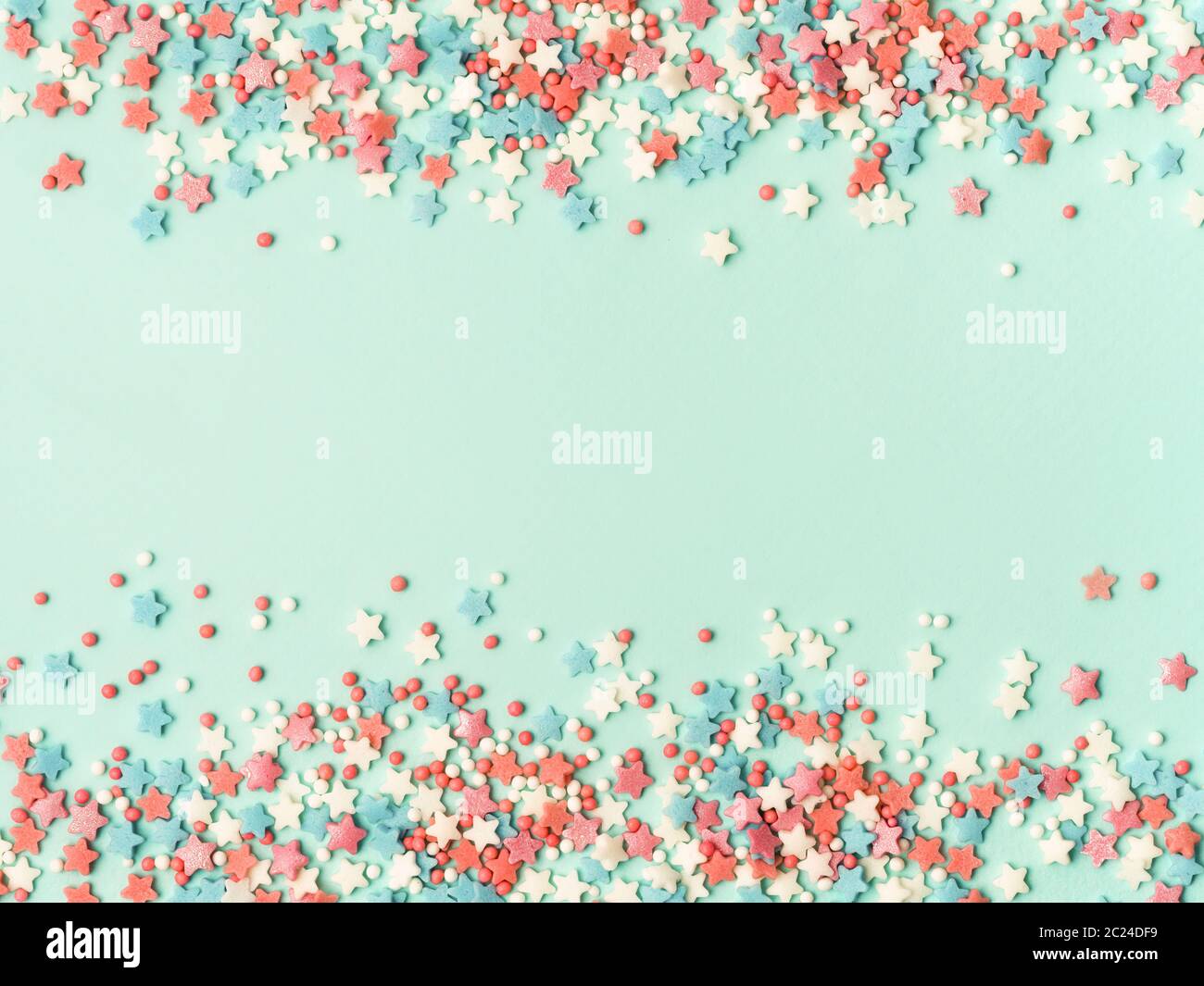 Festive border frame of colorful pastel sprinkles on blue background ...
