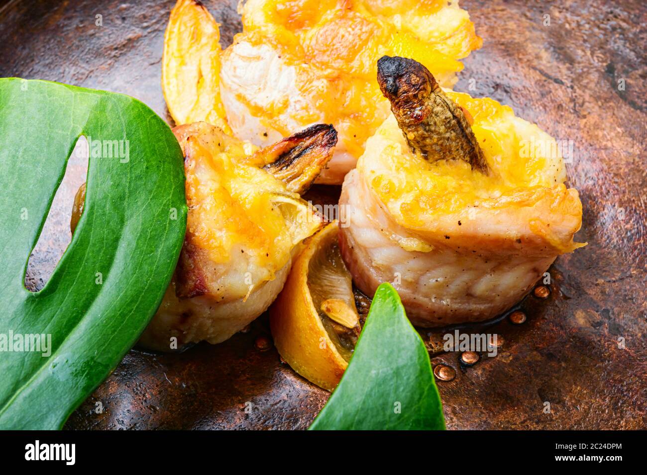 Baked fish with banana.Pangasius fillet with banana Stock Photo - Alamy