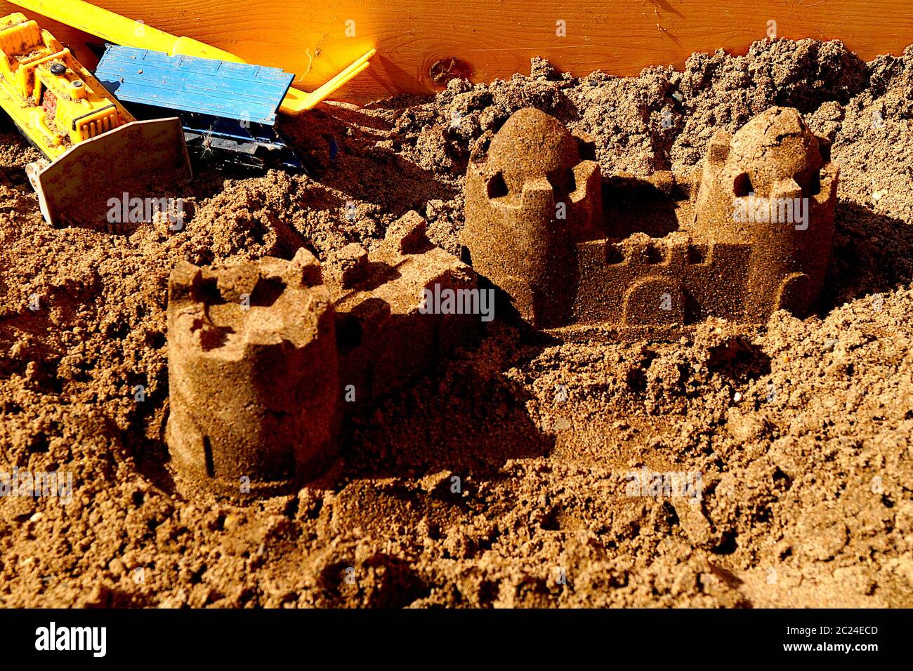 In the summer, the child built a sand castle in the sandbox. Childrens ...