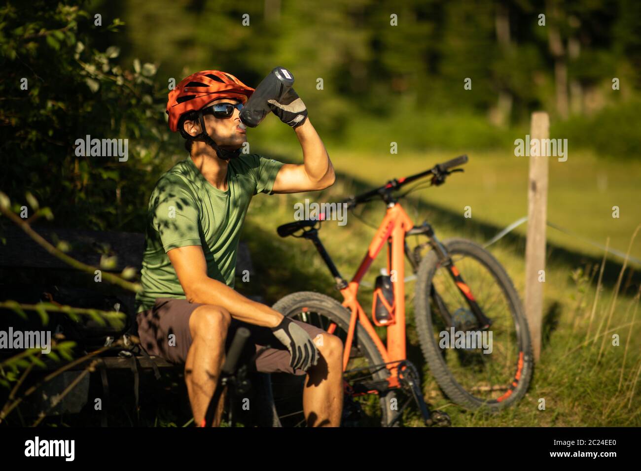 Young man biking on a mountain bike enjoying healthy active lifestyle ...