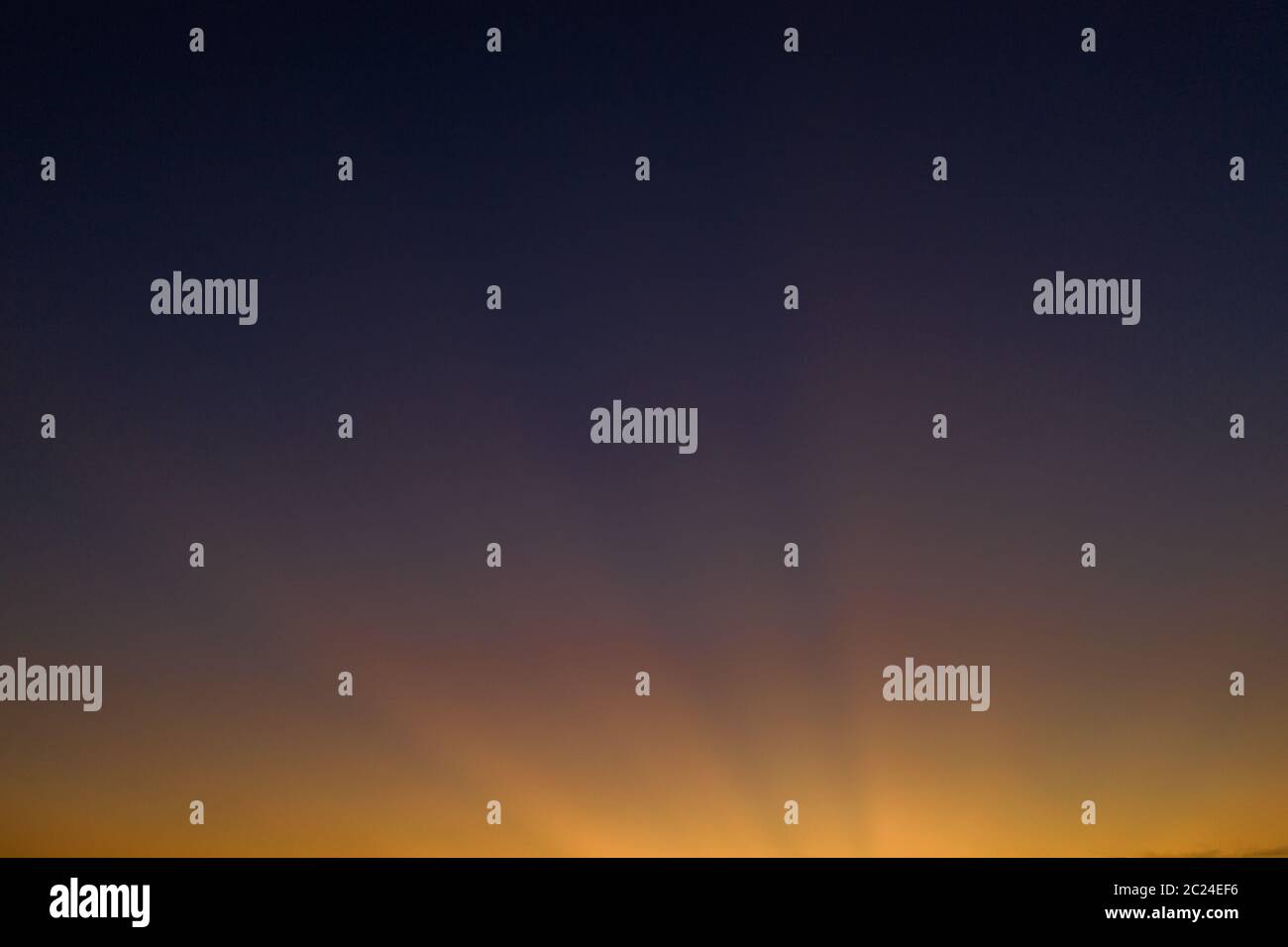 Low angle of sunset sun rays over sky Stock Photo - Alamy