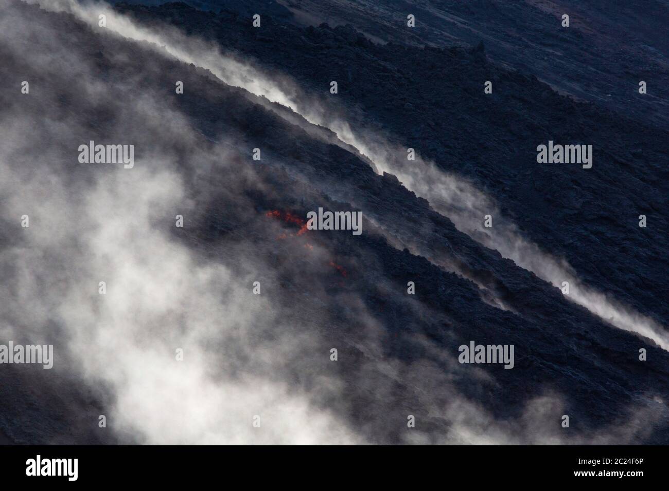 Black earth on volcano Stromboli with fire and steam Stock Photo - Alamy