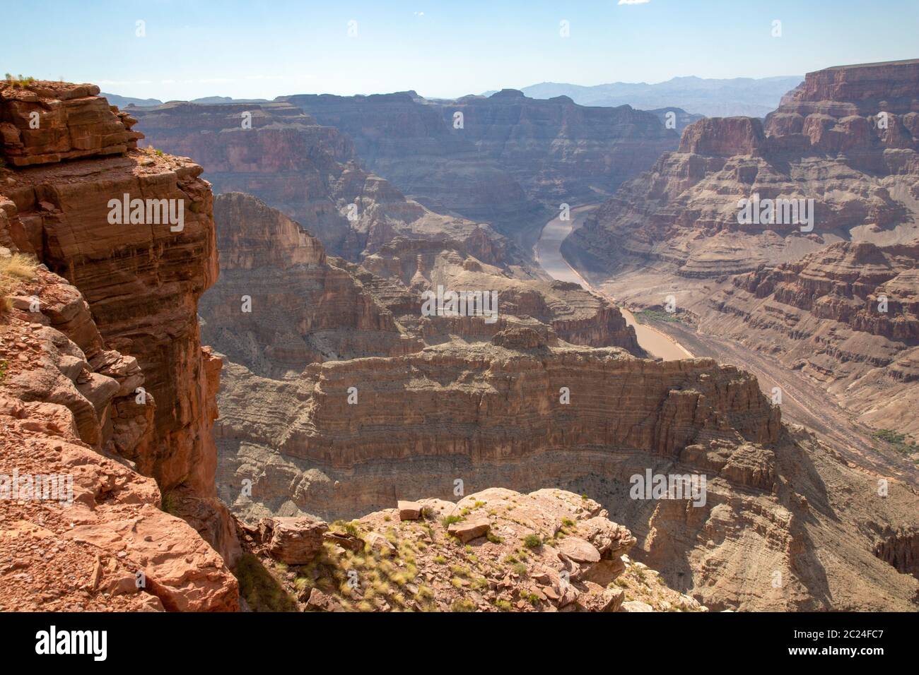 Red rock ledge falls vertically in canyon of Grand Canyon Stock Photo ...