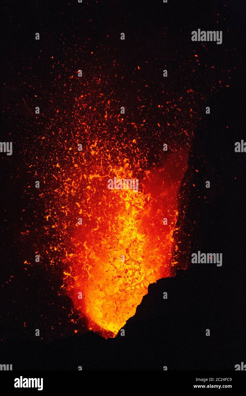 Eruption of active volcano with liquid lava in volcano crater Stock ...