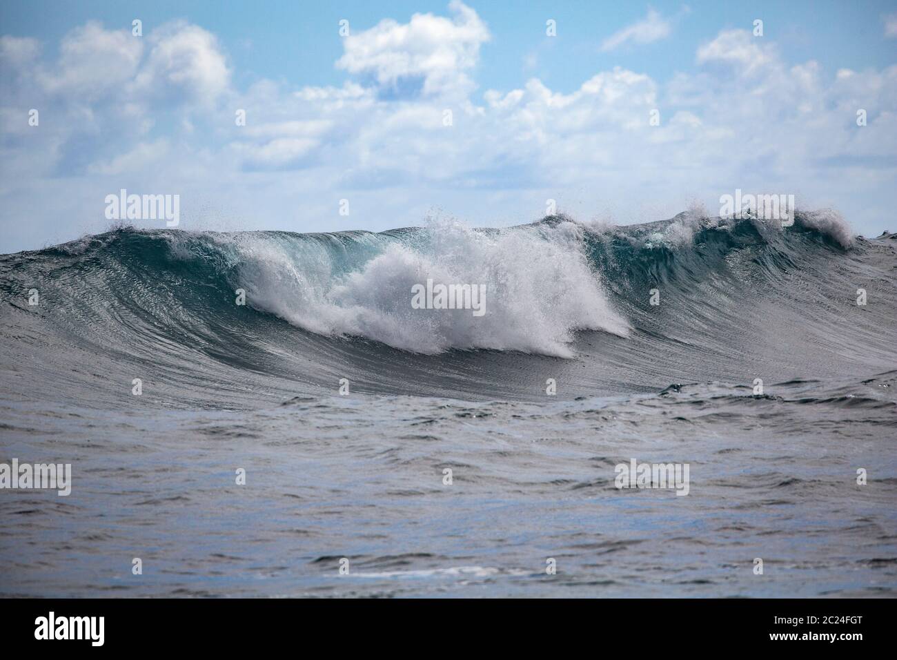 Wave builds up and rolls view to wave tunnel Stock Photo - Alamy
