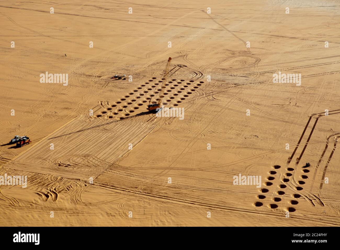 Ground compactors at work at the first stage of building foundations ...