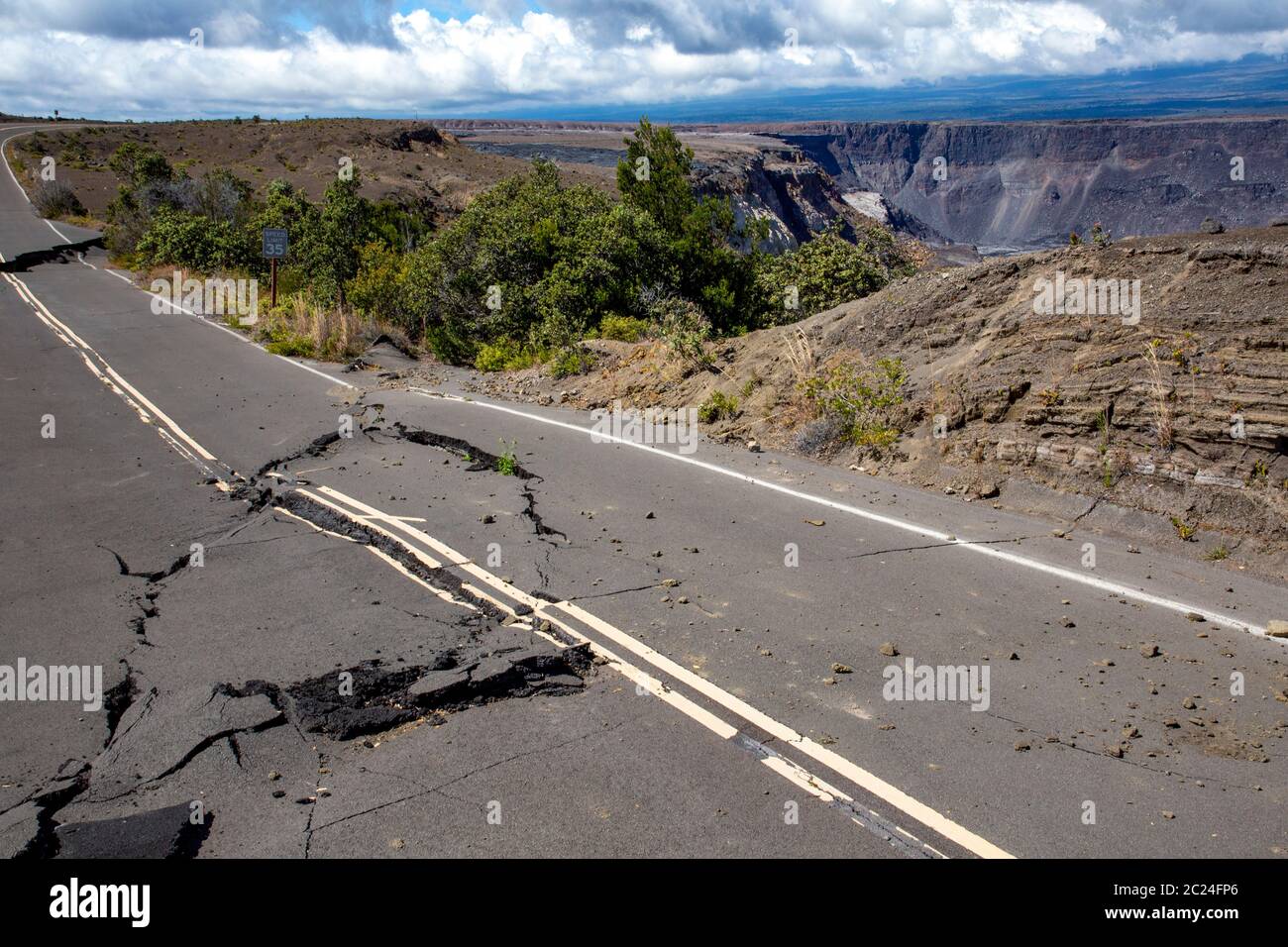 Cracks in asphalt destroy road at volcano crater due to natural ...