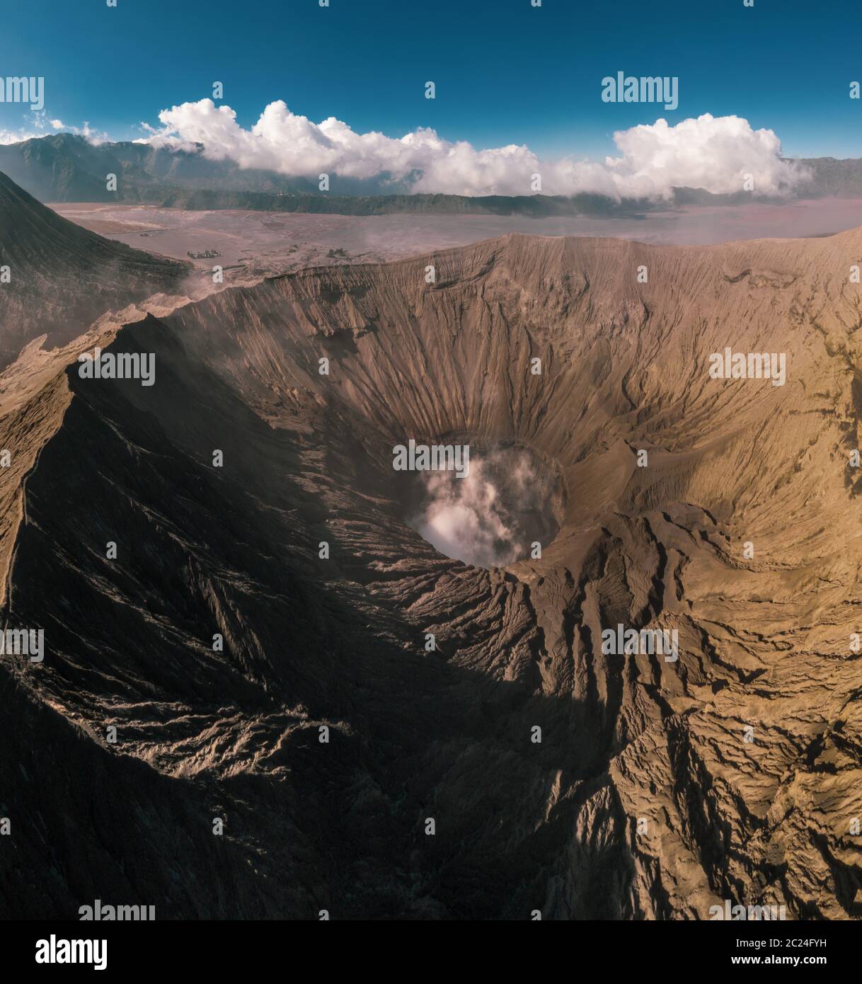 Cinematic shot aerial view of Mount Bromo crater with active volcano ...