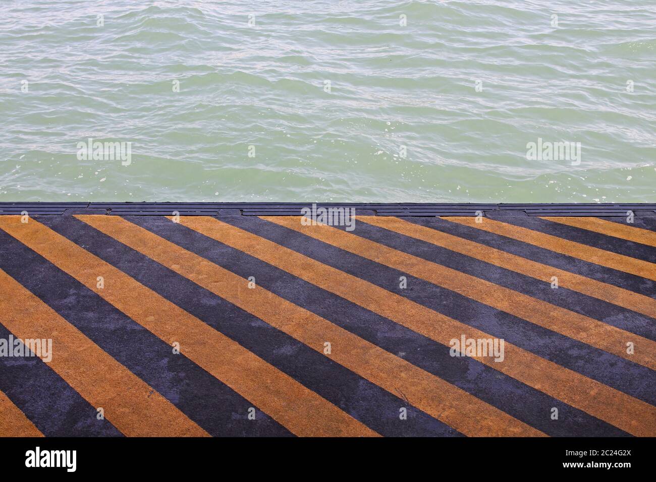 Yellow and Black Stripes Pattern at Pier Dock Pontoon Stock Photo - Alamy