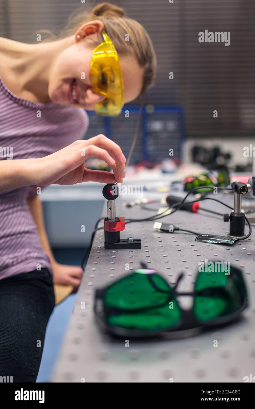 Female scientist carrying out research experiments in a quantum optics ...