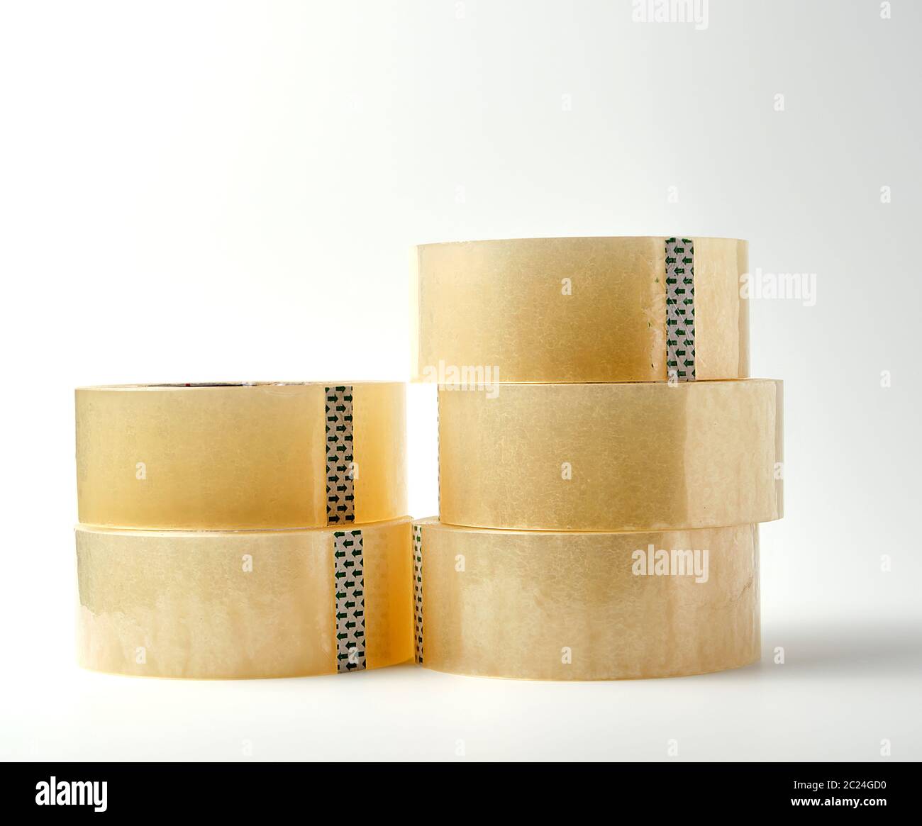 two stacks of transparent adhesive tape on a white background, close up ...