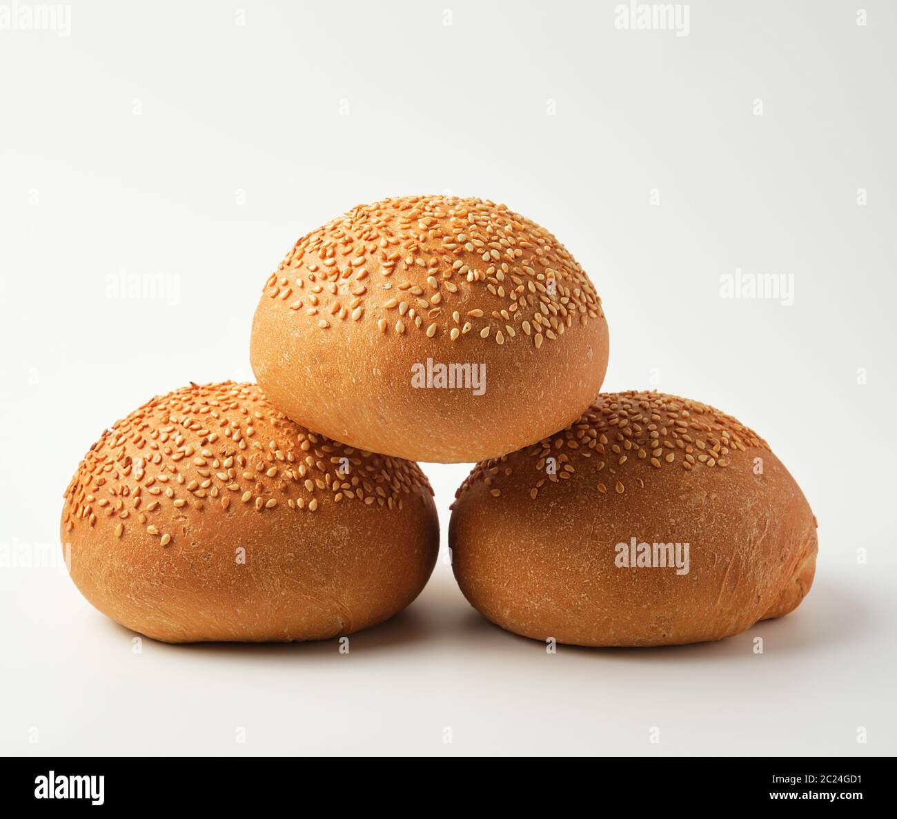 stack of baked whole round bun with sesame seeds made from white wheat ...