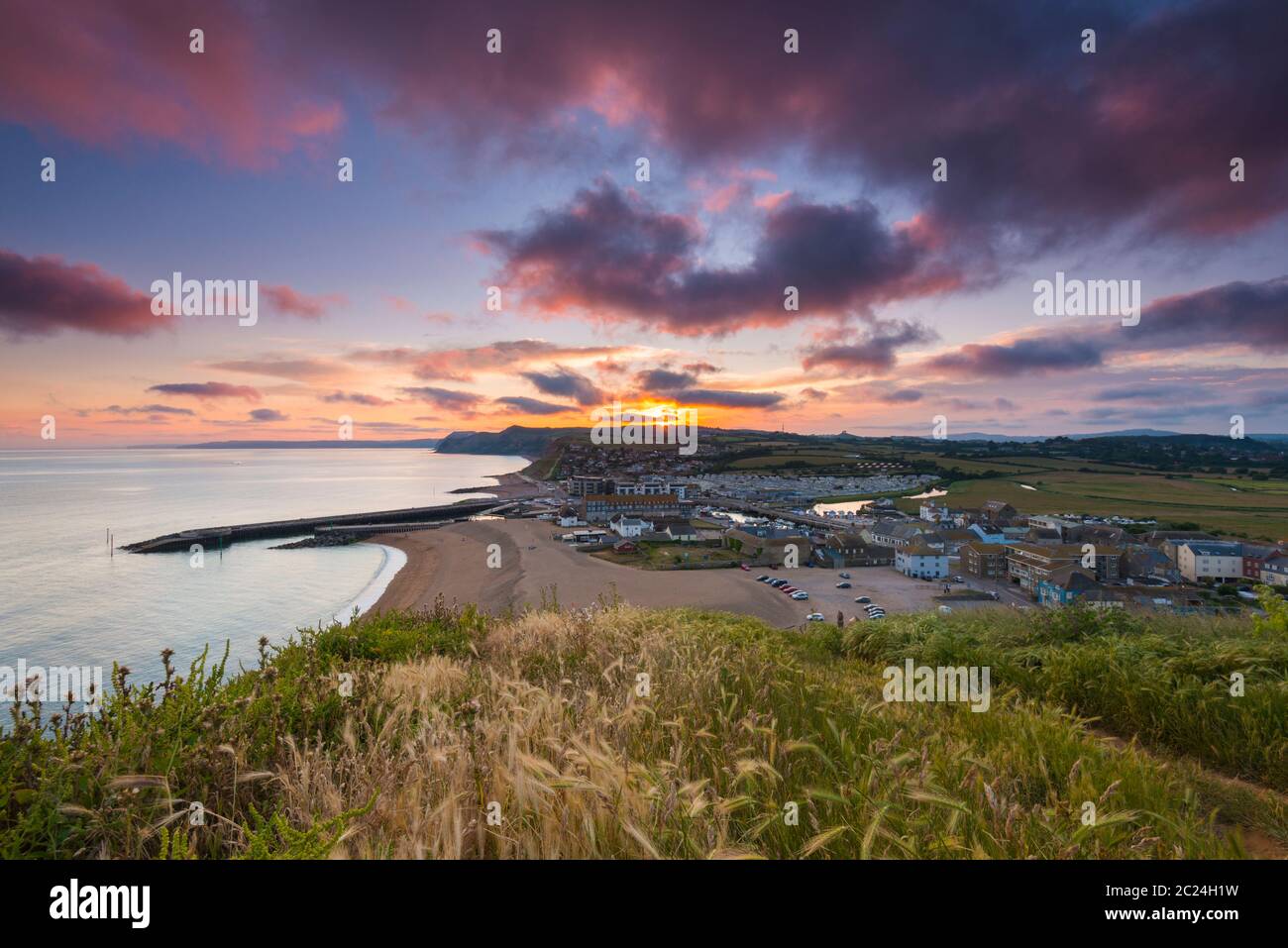 West Bay, Dorset, UK. 16th June 2020. UK Weather. A dramatic sunset at ...