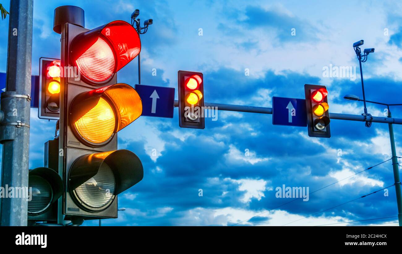Traffic lights over urban intersection. Red light Stock Photo - Alamy