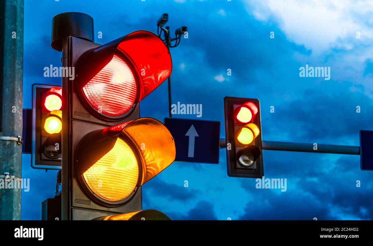 Traffic lights over urban intersection. Red light Stock Photo - Alamy