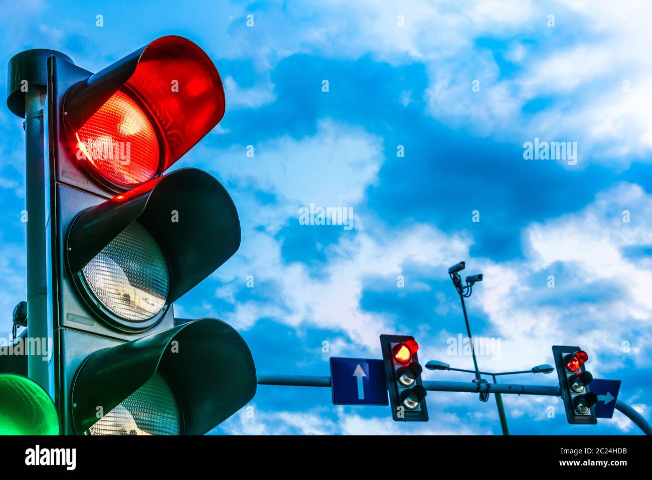 Traffic lights over urban intersection. Red light Stock Photo - Alamy